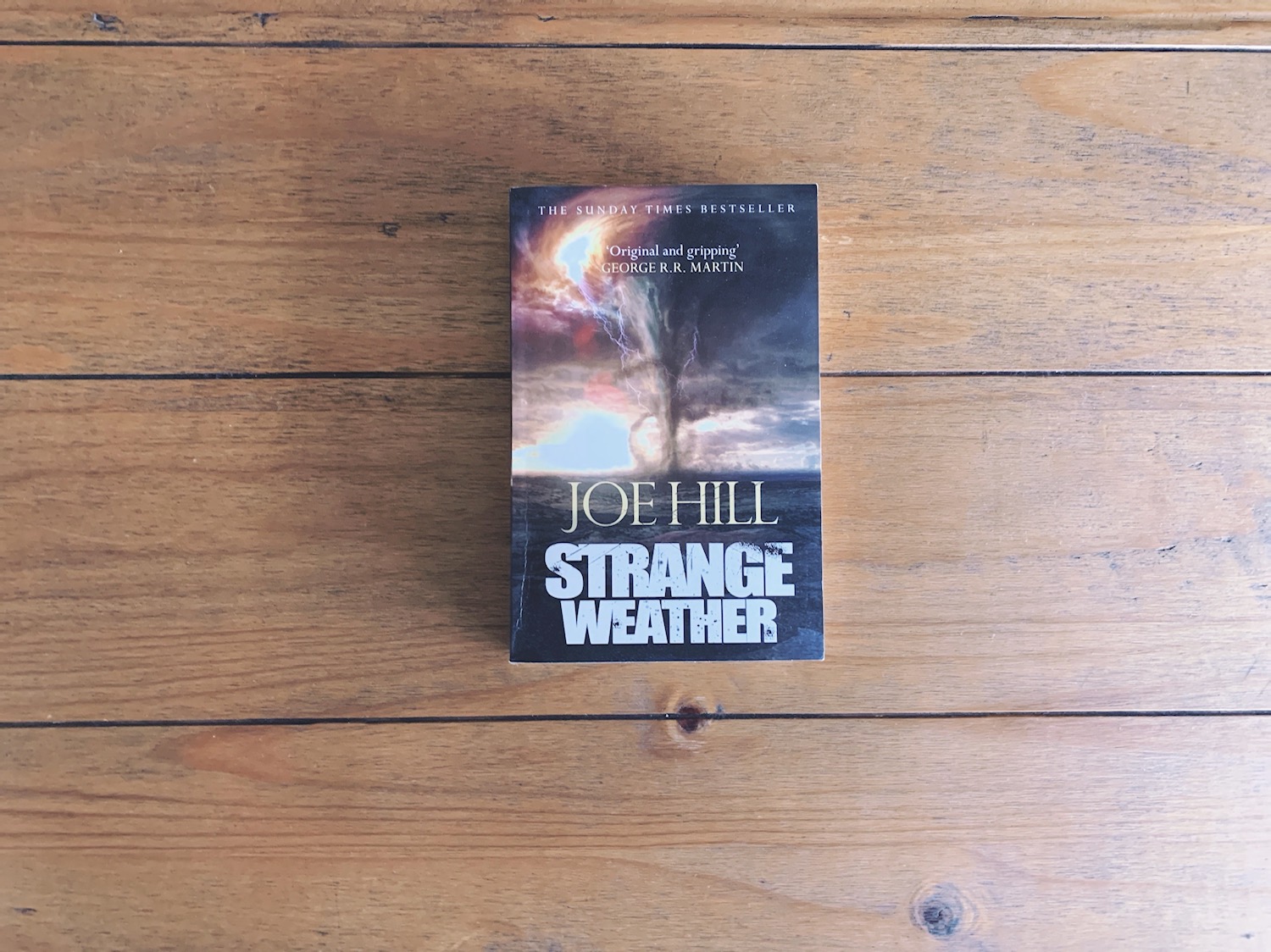 Book Review: Strange Weather – Escape Through The Pages